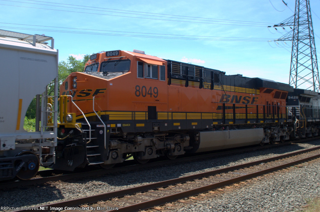 BNSF ES44C4 8049 trails on 33K